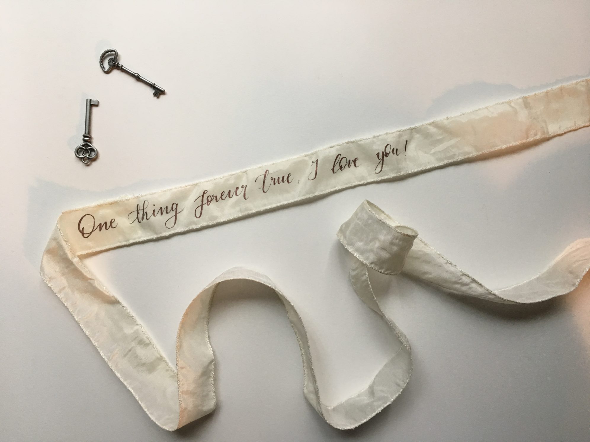 calligraphy: hand-lettering on ribbon – Andrea Casals